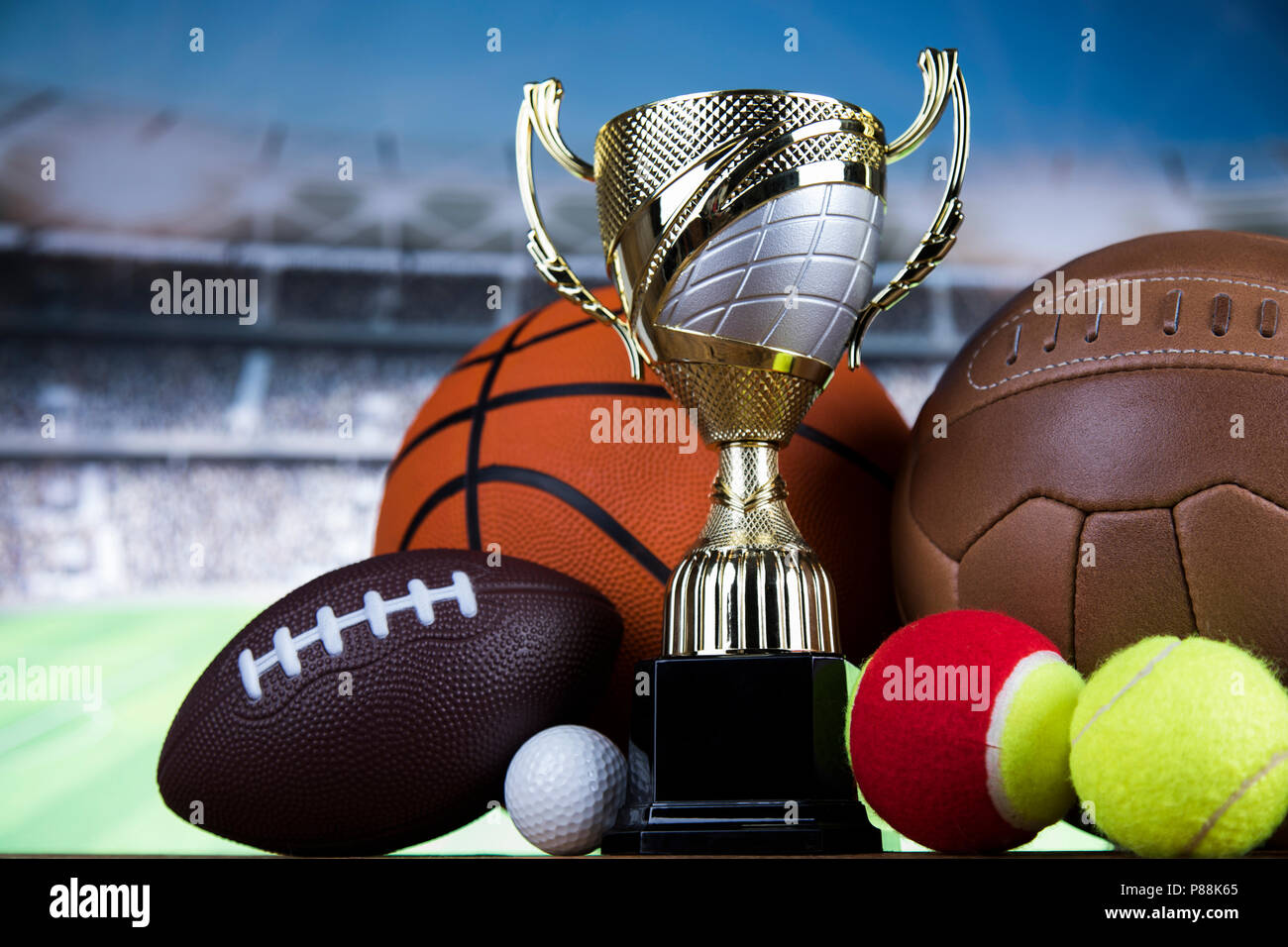 Cups of winners award, Sport equipment and balls Stock Photo - Alamy