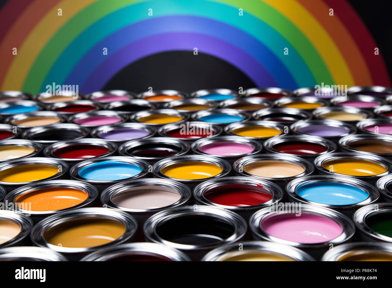 Rainbow, tin metal cans with color paint Stock Photo - Alamy