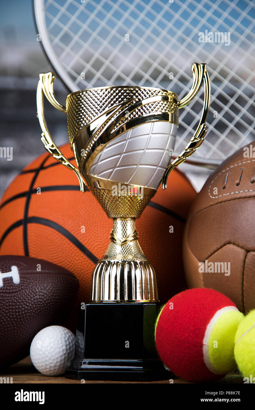 Cups of winners award, Sport equipment and balls Stock Photo - Alamy