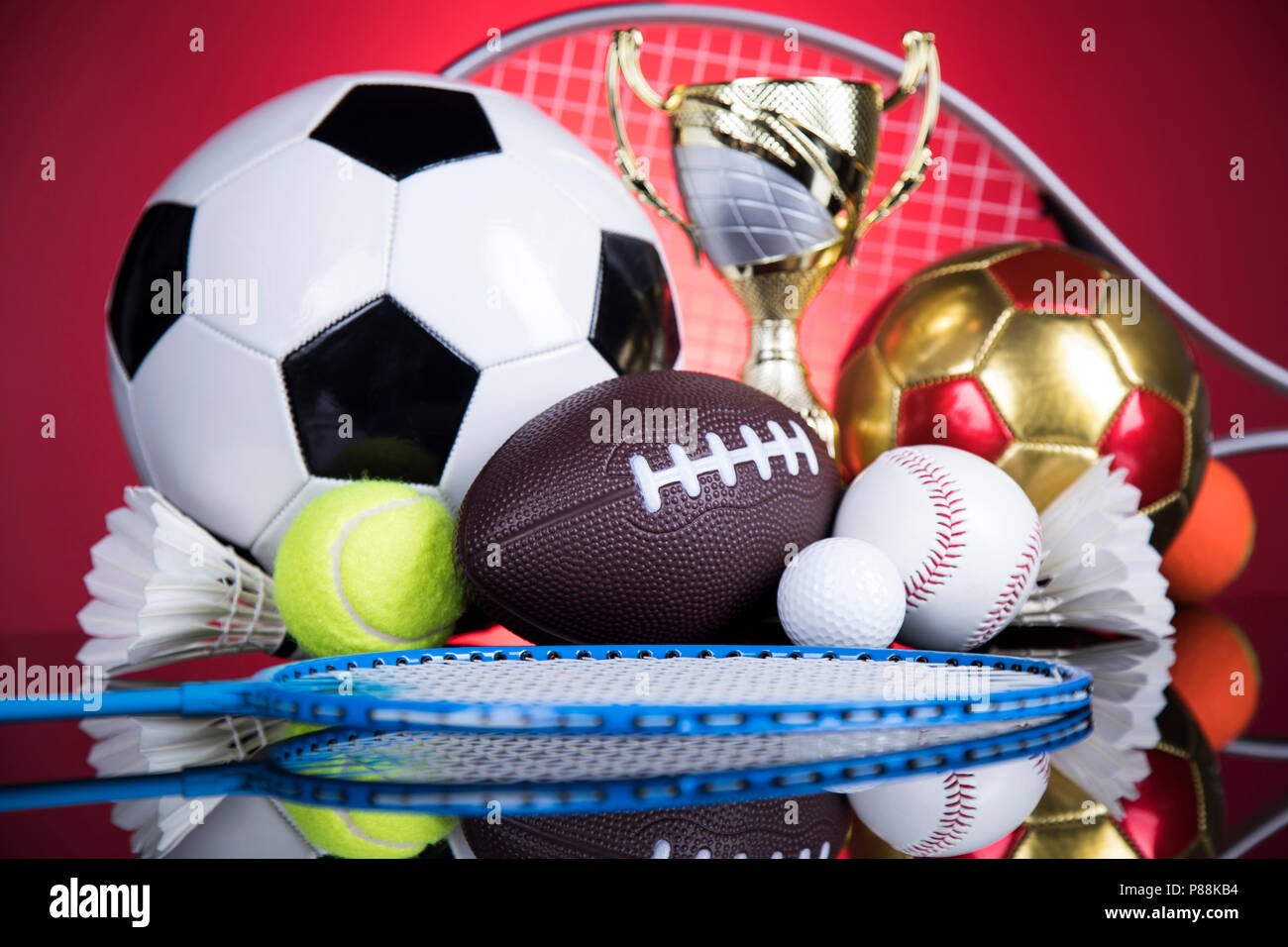 Cups of winners award, Sport equipment and balls Stock Photo - Alamy