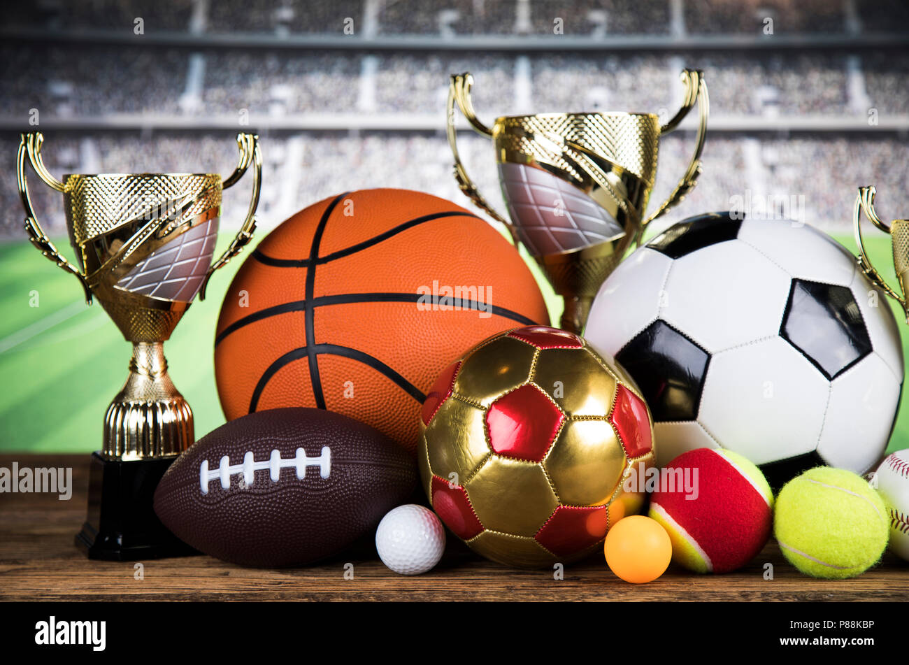 Cups of winners award, Sport equipment and balls Stock Photo - Alamy