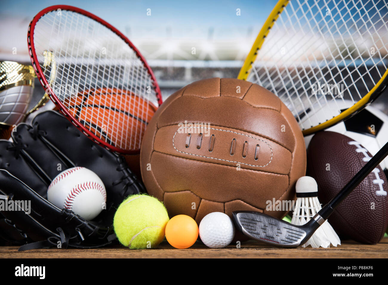 Cups of winners award, Sport equipment and balls Stock Photo - Alamy