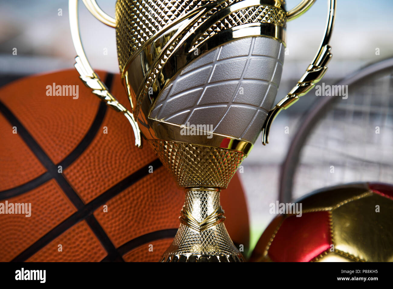 Cups of winners award, Sport equipment and balls Stock Photo - Alamy