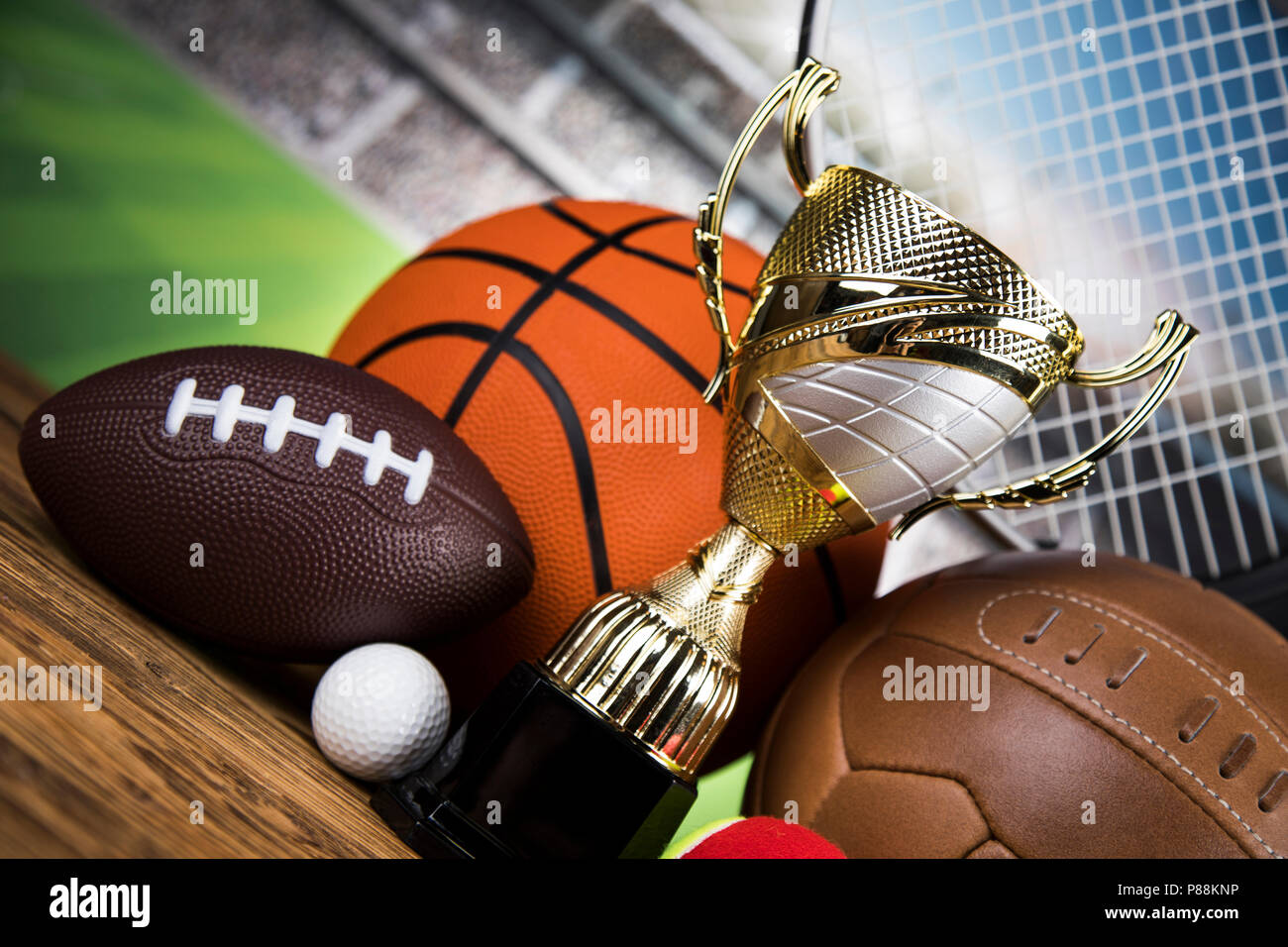 Cups of winners award, Sport equipment and balls Stock Photo - Alamy