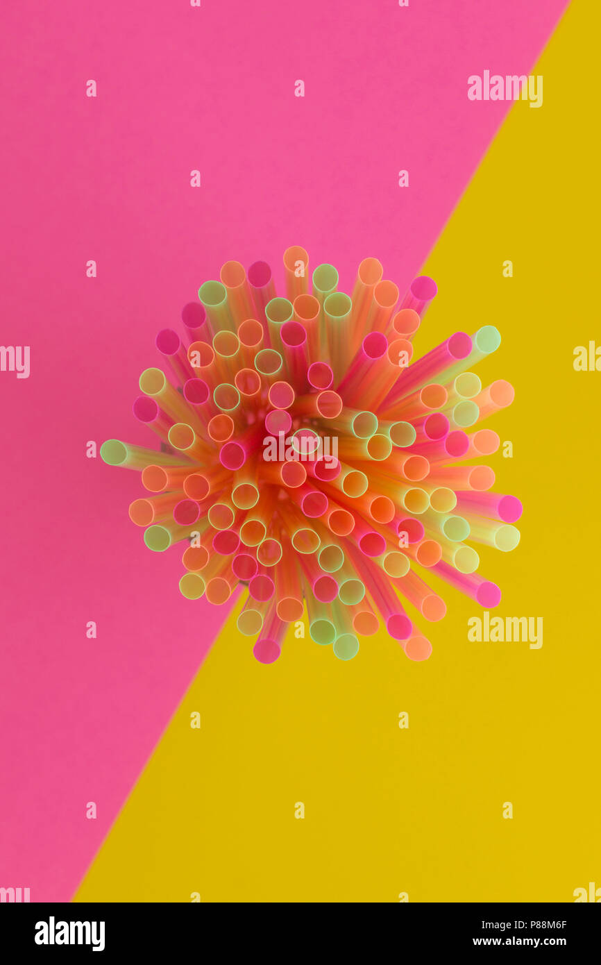 Creative view of drinking straws(neon colors) party on a two-tone ...