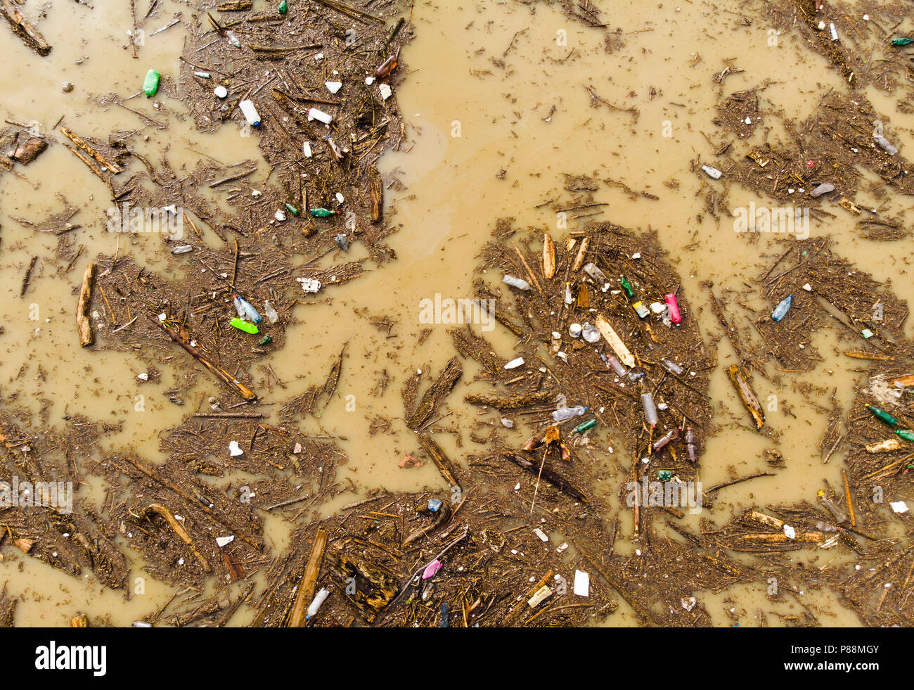 lake water pollution with plastic bags and dirt Stock Photo - Alamy