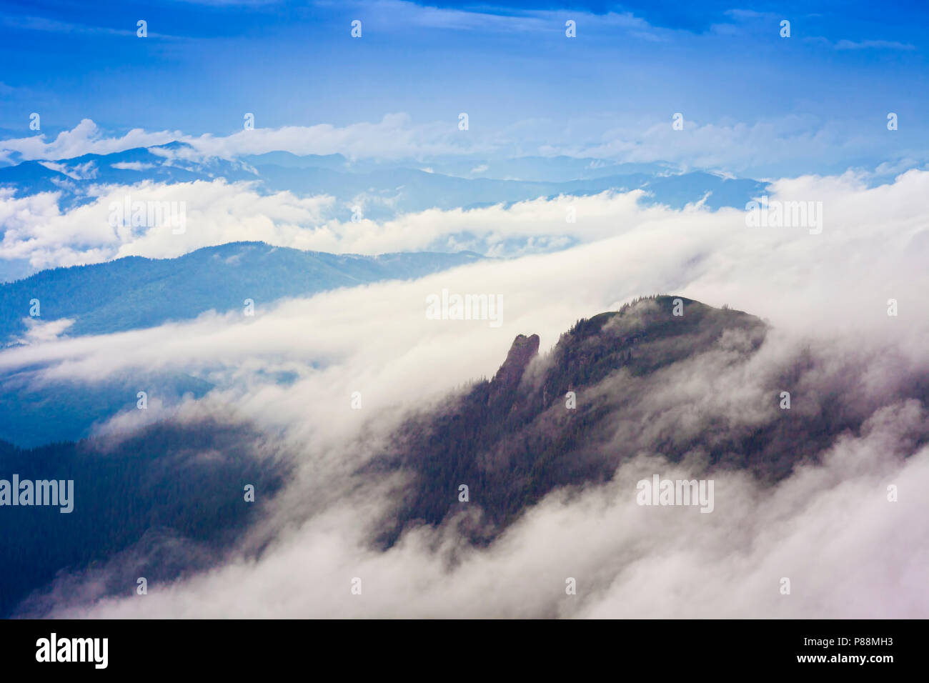rain clouds and fog in the mountain of Ceahlu, Romania Stock Photo - Alamy