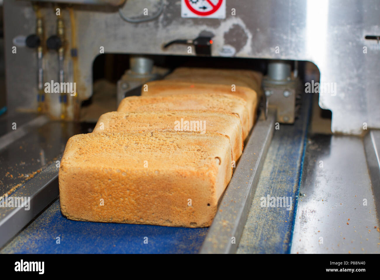 Industrial bread production line Stock Photo - Alamy