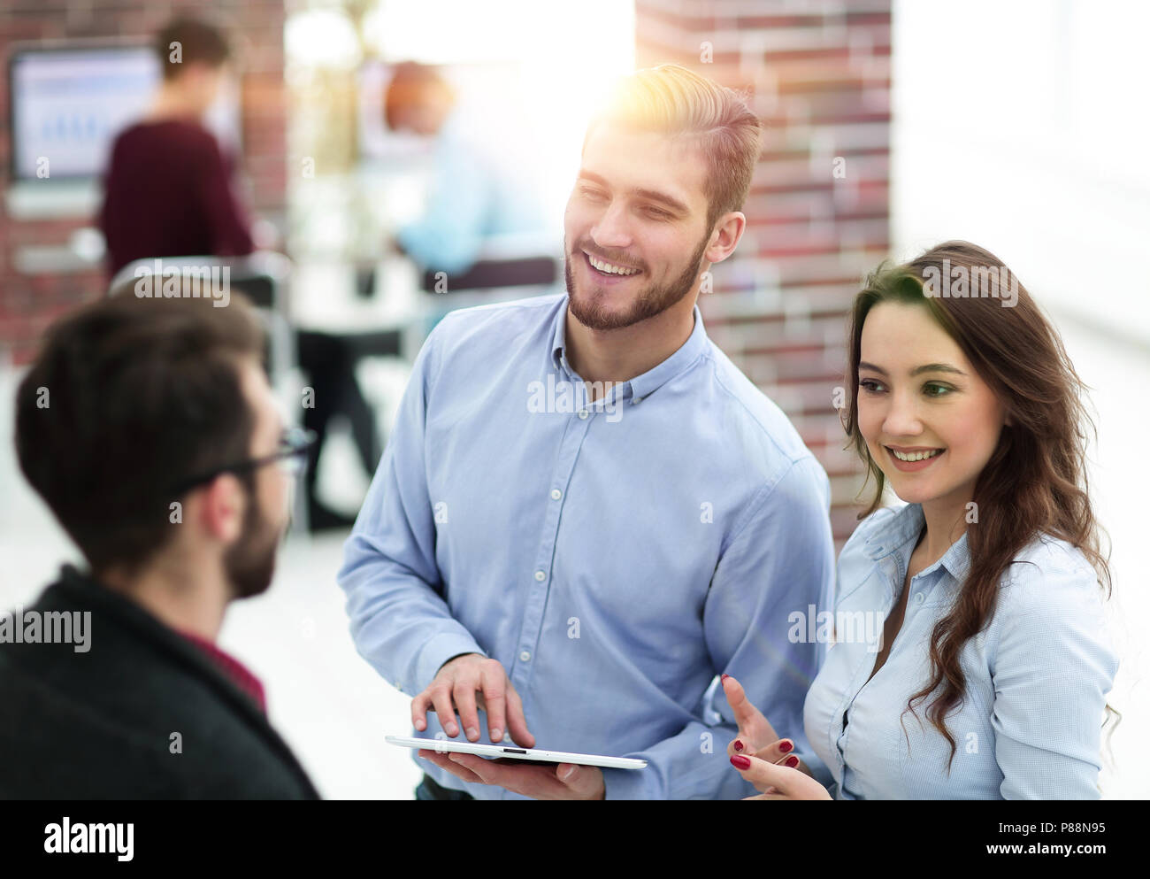 Business team with tablet in office Stock Photo - Alamy