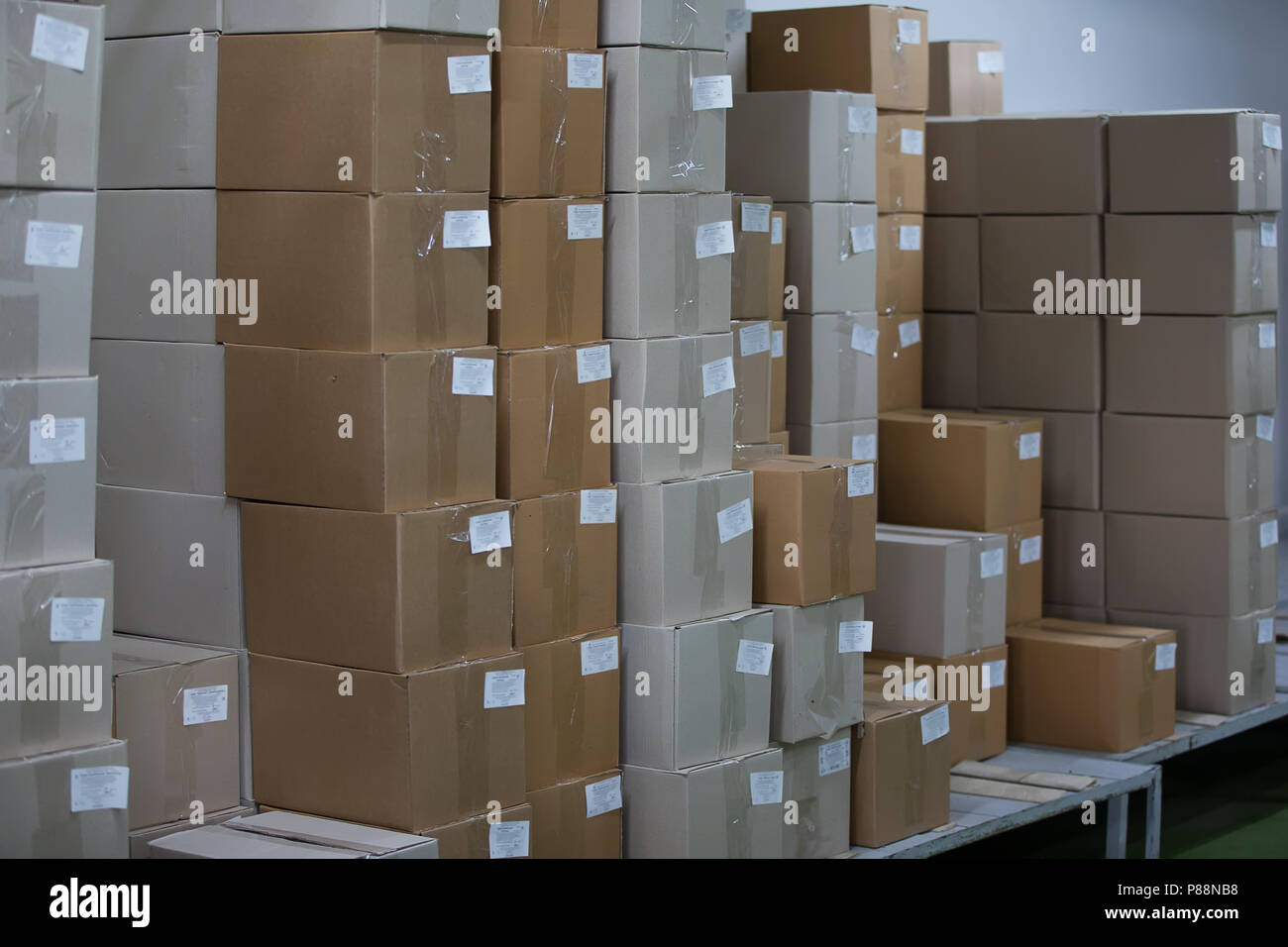 Warehouse with cardboard boxes Stock Photo - Alamy