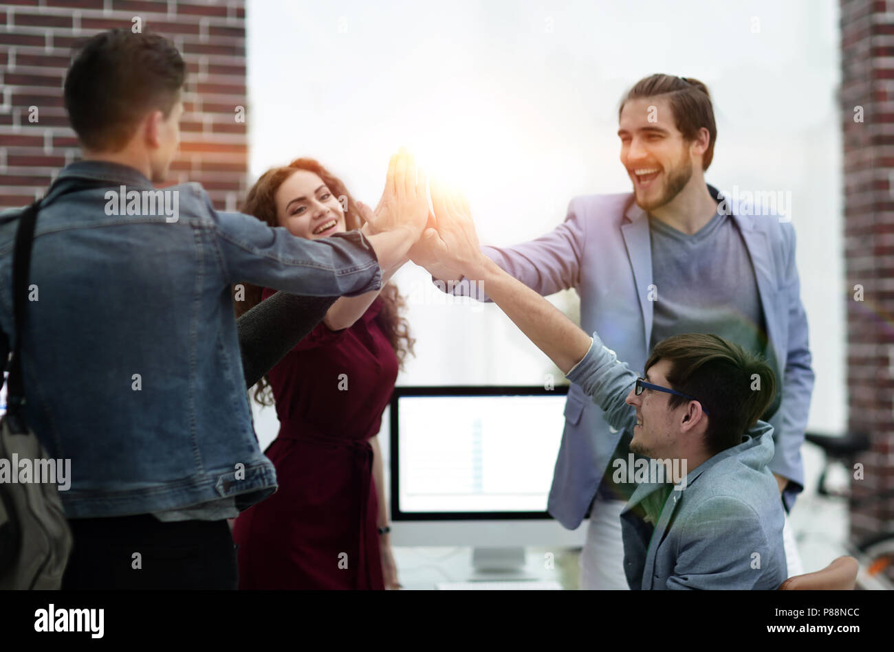 business team showing unity with their hands together Stock Photo - Alamy