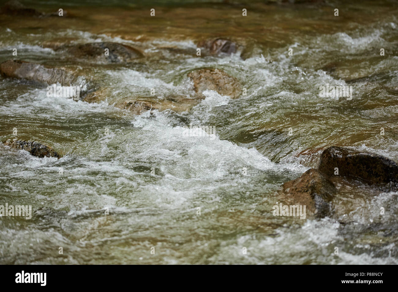 Landscape with river flowing through rocks Stock Photo - Alamy