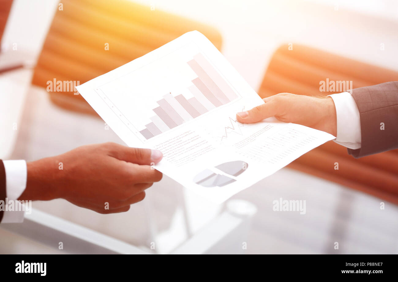 Business people discussing financial graphs Stock Photo - Alamy