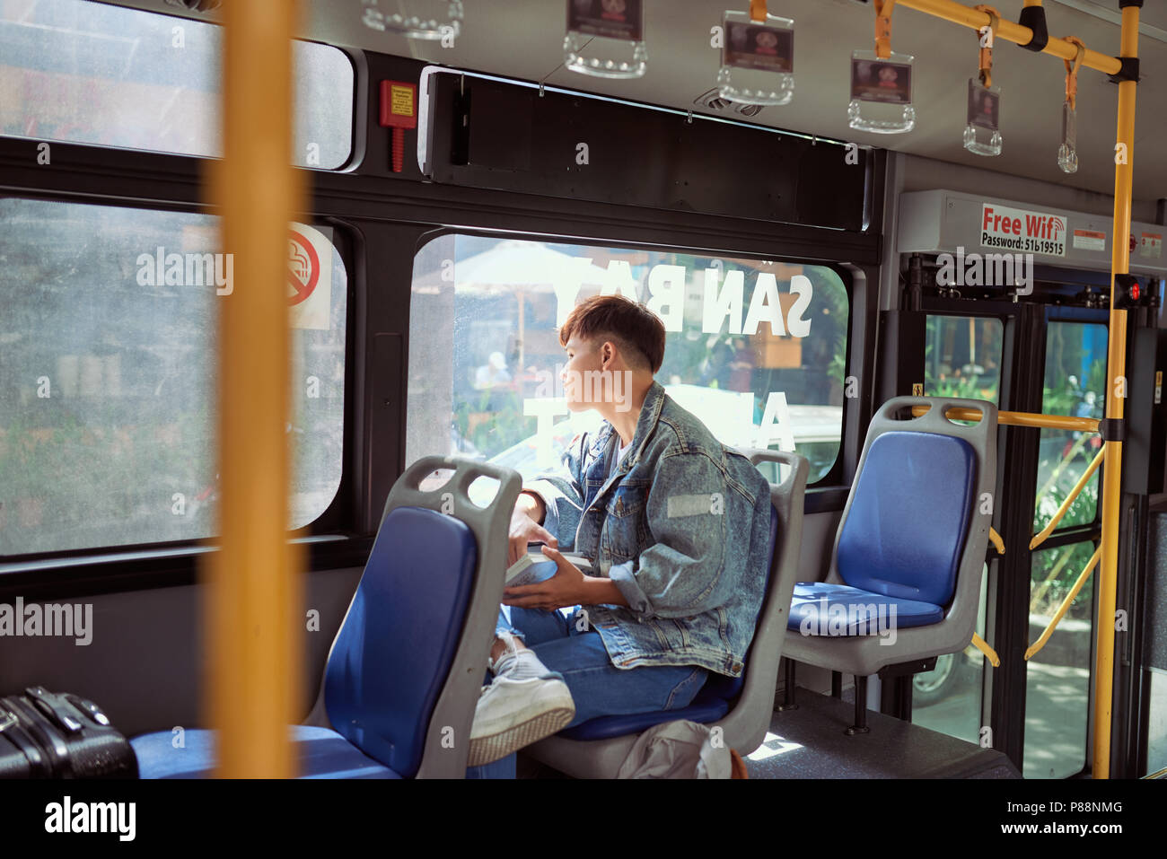 passenger traveler looking at window in bus, man tourist sitting in bus ...