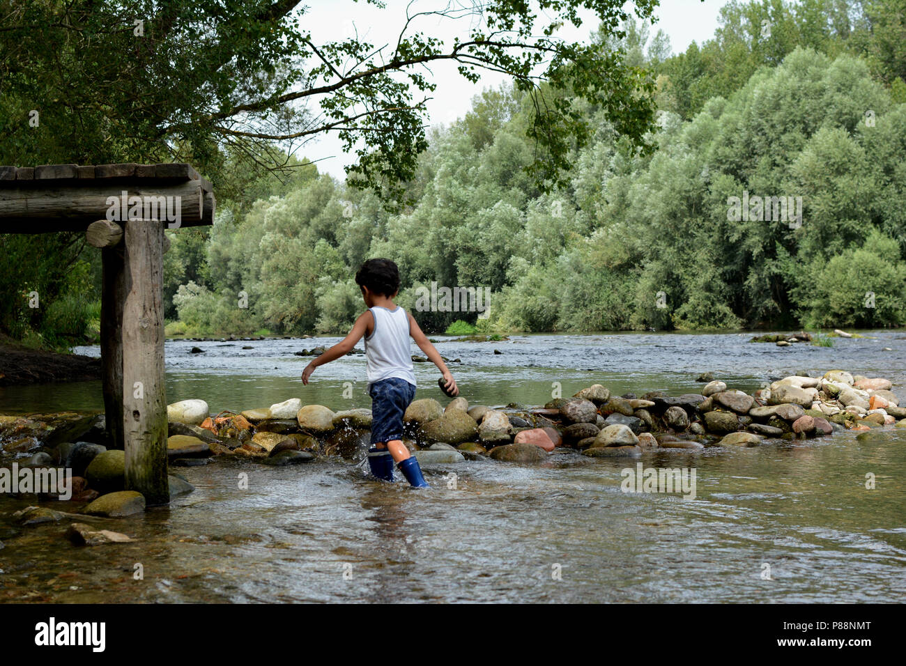 Throwing rocks river hi-res stock photography and images - Alamy