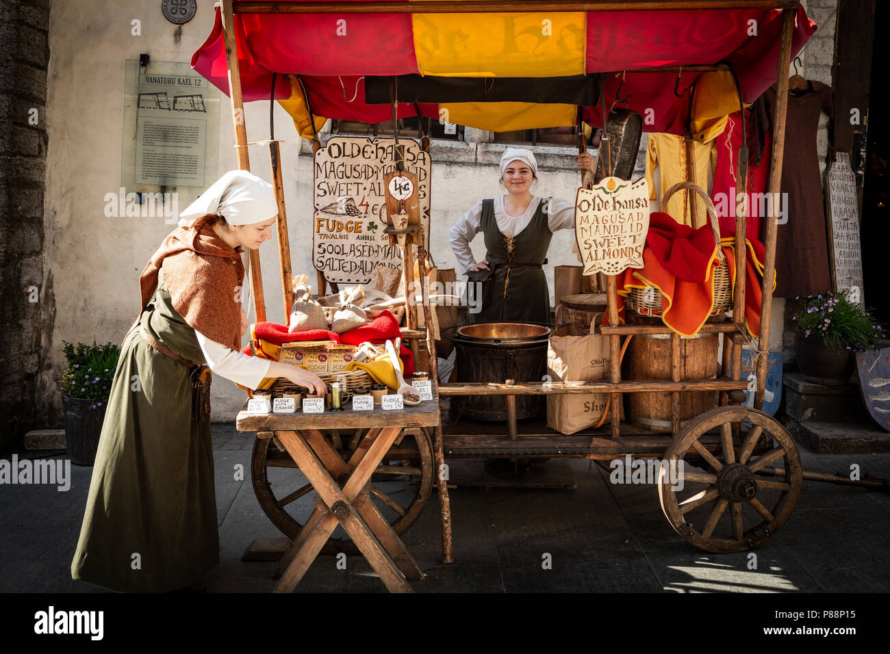 Young womans selling candy in a street of Tallin, Estonia Stock Photo ...