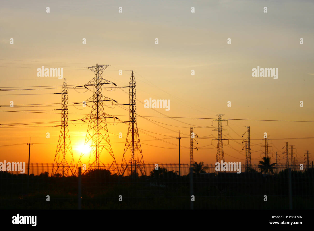 transmission power line on sunset Stock Photo - Alamy