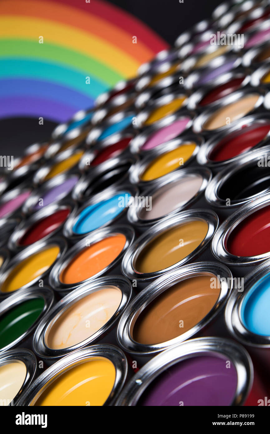 Full Buckets of rainbow colored oil paint Stock Photo - Alamy