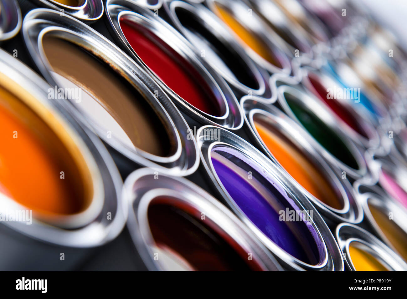 Group of tin metal cans with color paint Stock Photo - Alamy