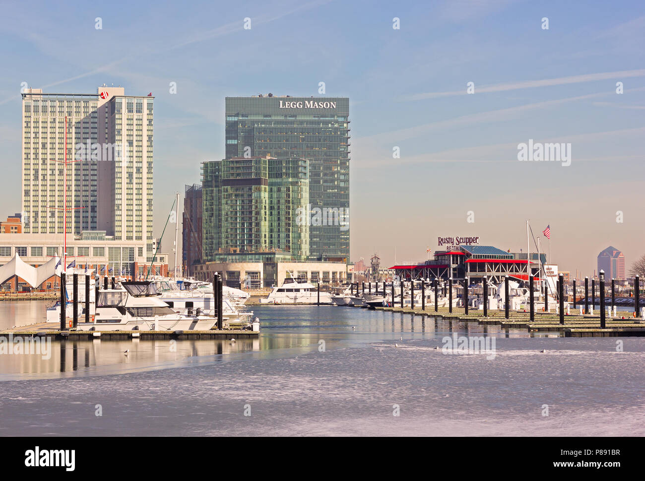 Docked yachts, Rusty Scupper restaurant, Legg Mason Tower and Marriott ...