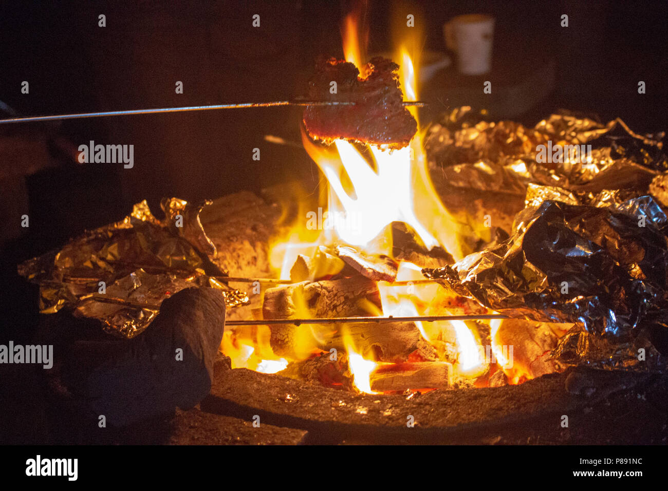A meat being cook by the barbecue Stock Photo - Alamy