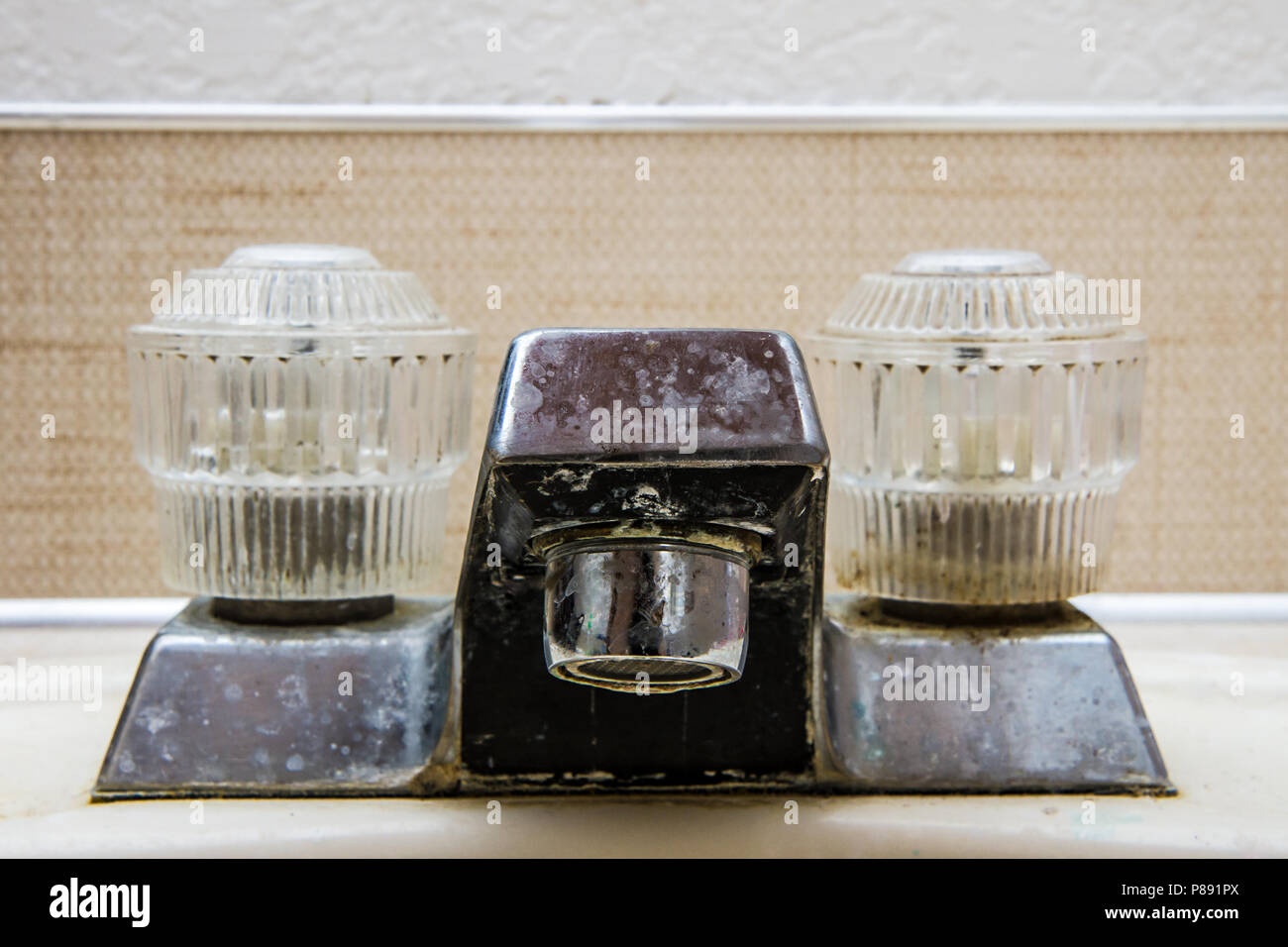 Faucet showing lots of grime and dirt buildup on it Stock Photo - Alamy