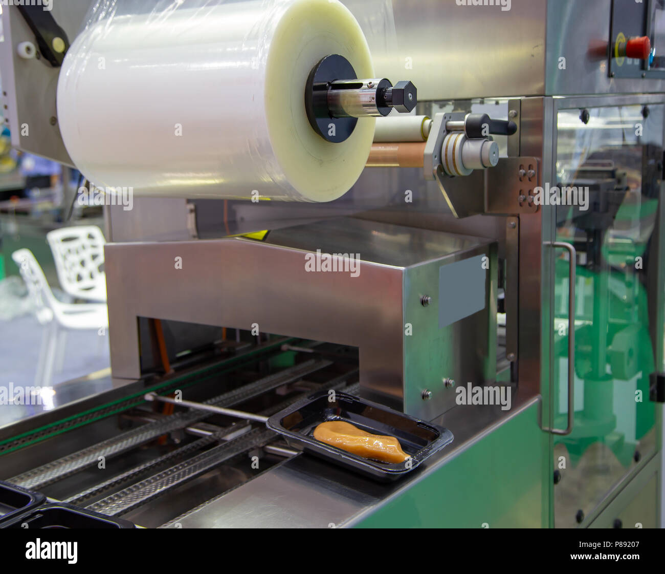 Packing fresh meat in production line Stock Photo - Alamy