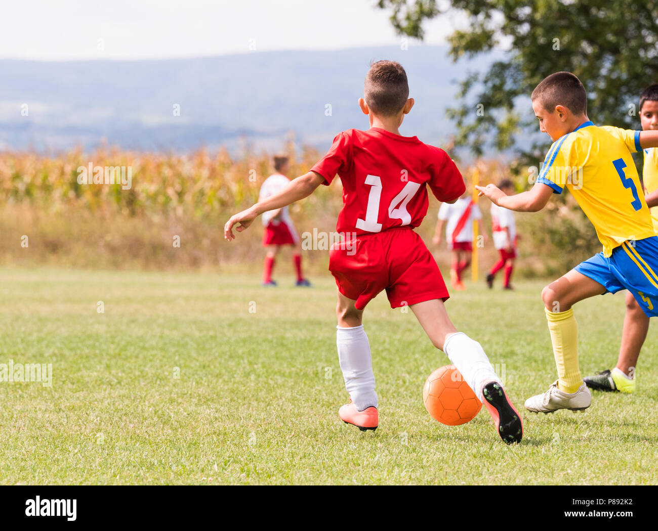 Kids soccer football - young children players match on soccer field ...