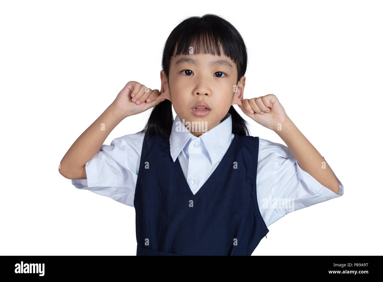 Asian Little Chinese Girl pulling her ears in isolated White Background ...