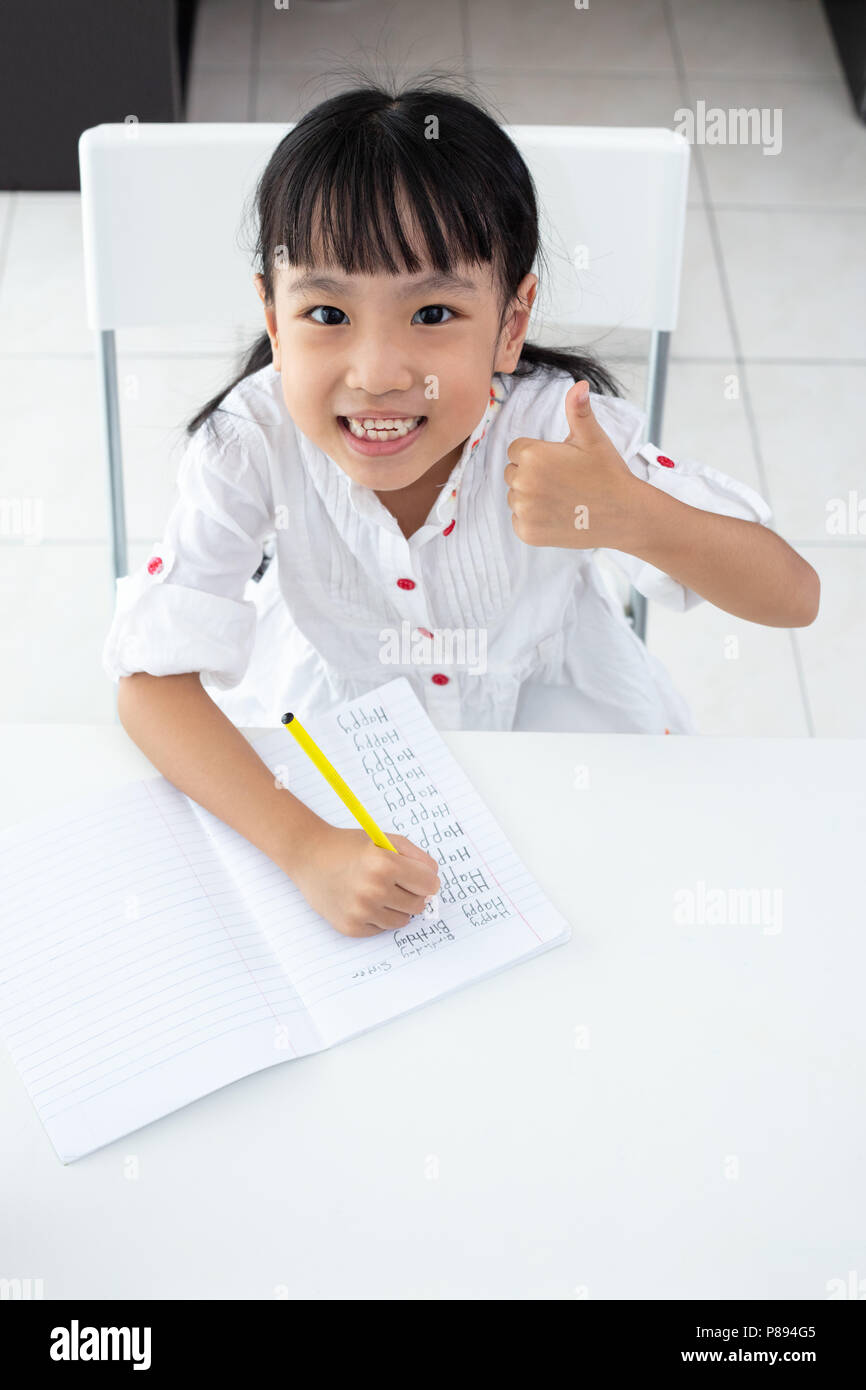 Asian Little Chinese girl doing homework at home Stock Photo - Alamy