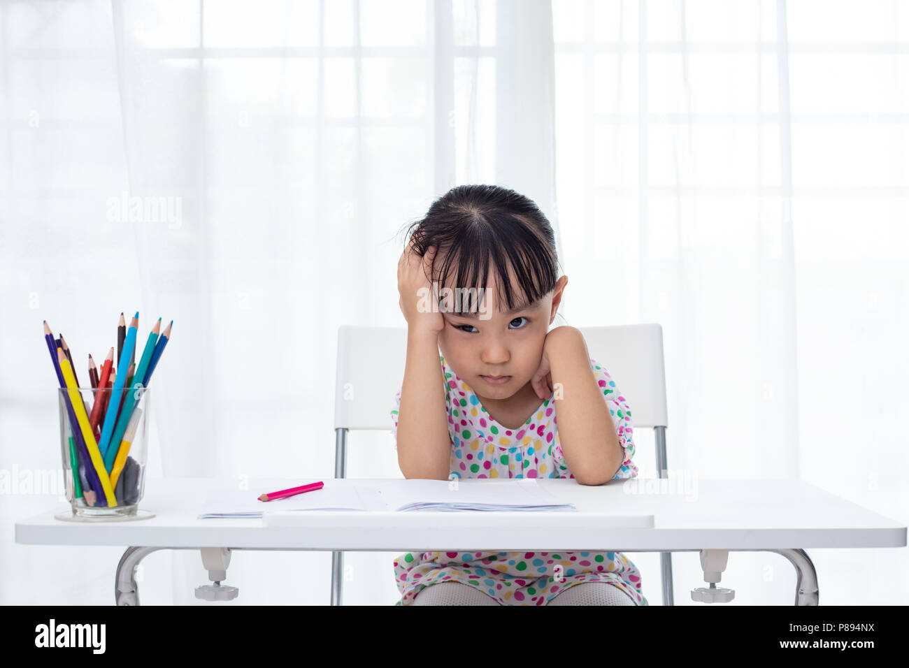 Asian Little Chinese girl doing homework at home Stock Photo - Alamy