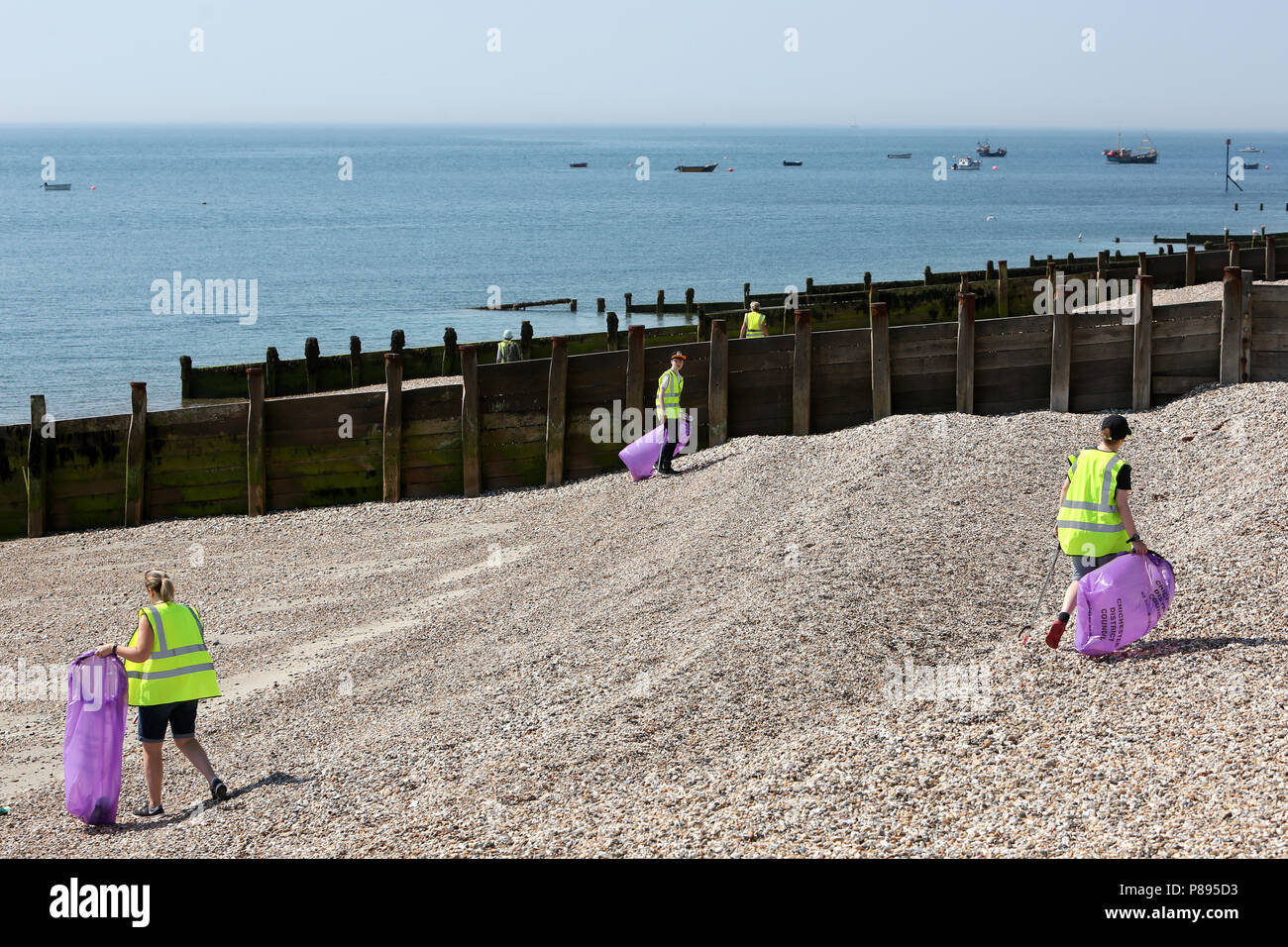 Teenagers clean beach waste hi-res stock photography and images - Alamy