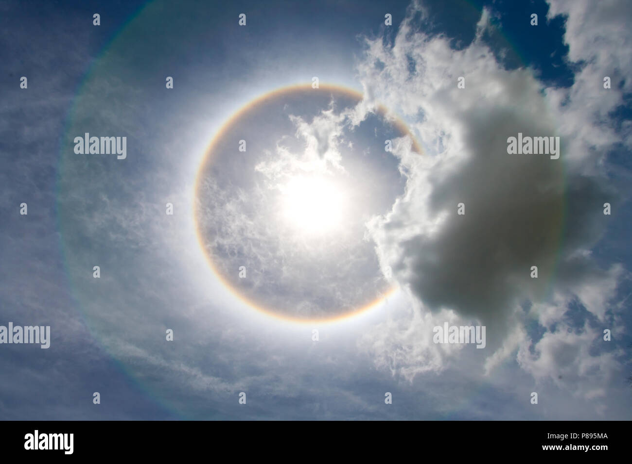 Sun with circular rainbow - sun halo Stock Photo - Alamy