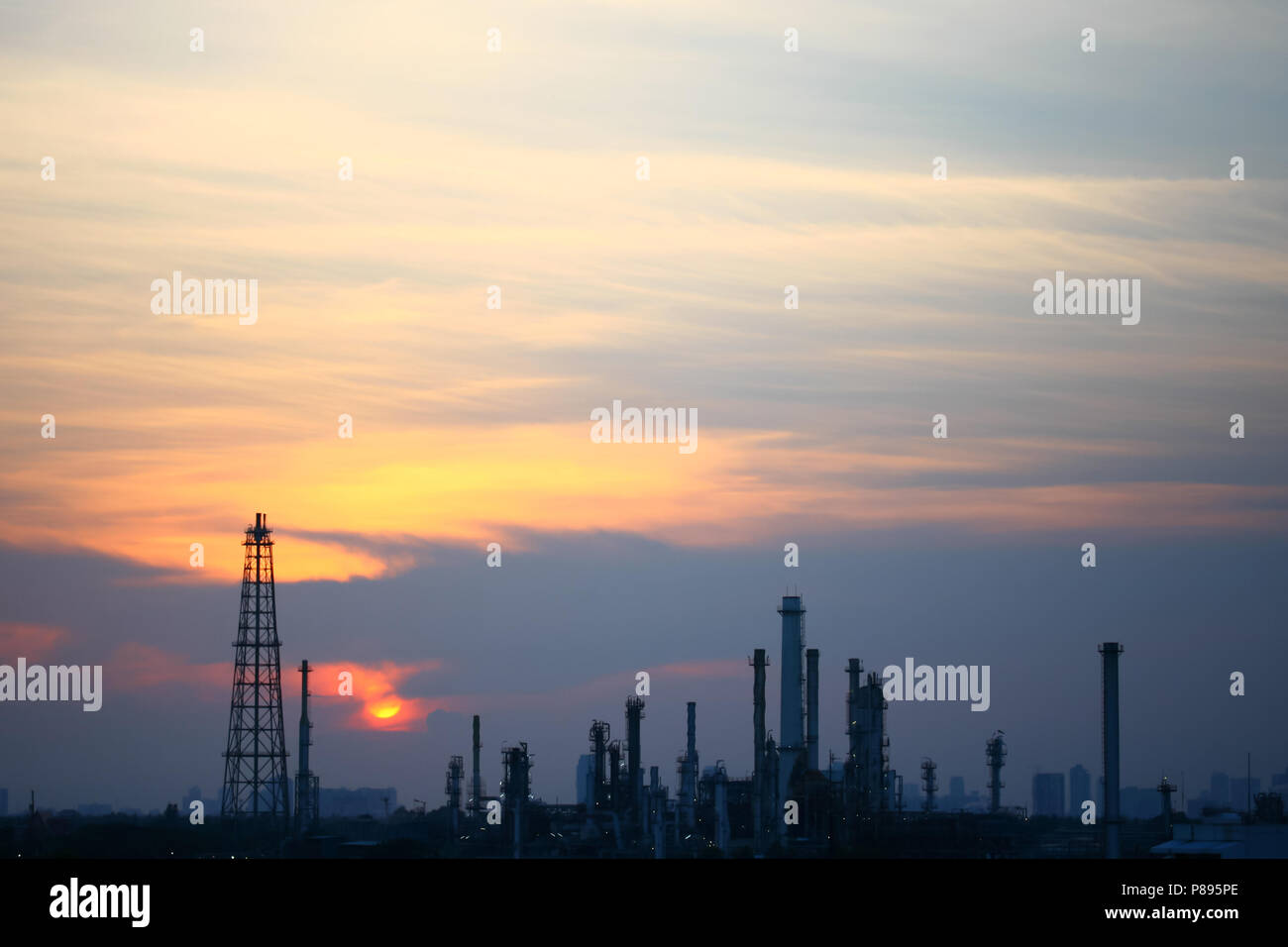 Oil refinery at sunset Stock Photo - Alamy
