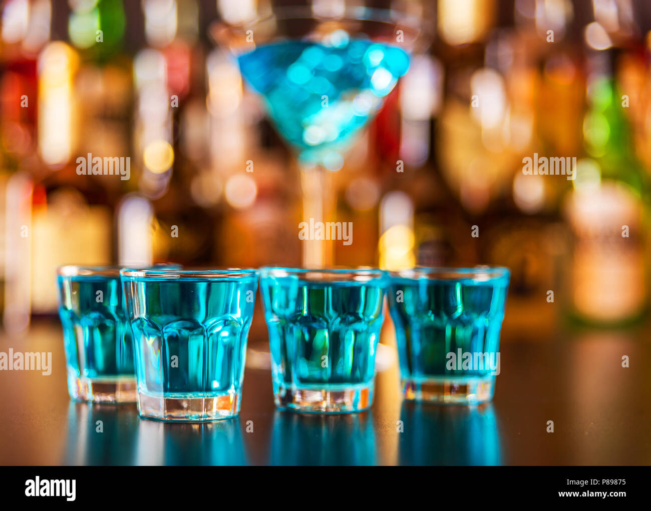 Popular blue drink shot kamikaze on the background of the bar with ...
