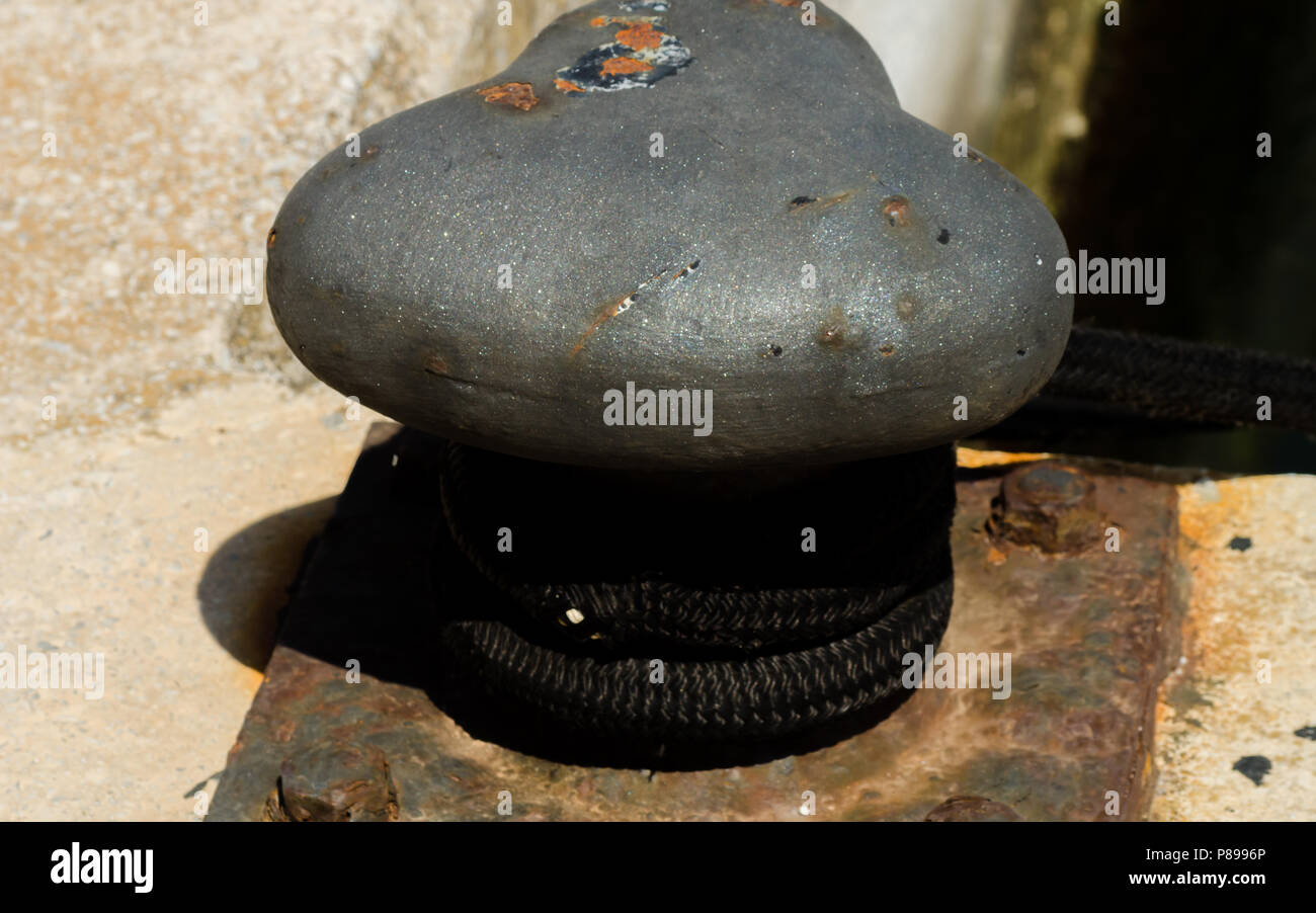 mooring post on the waterfront in a small marina, element for mooring ...