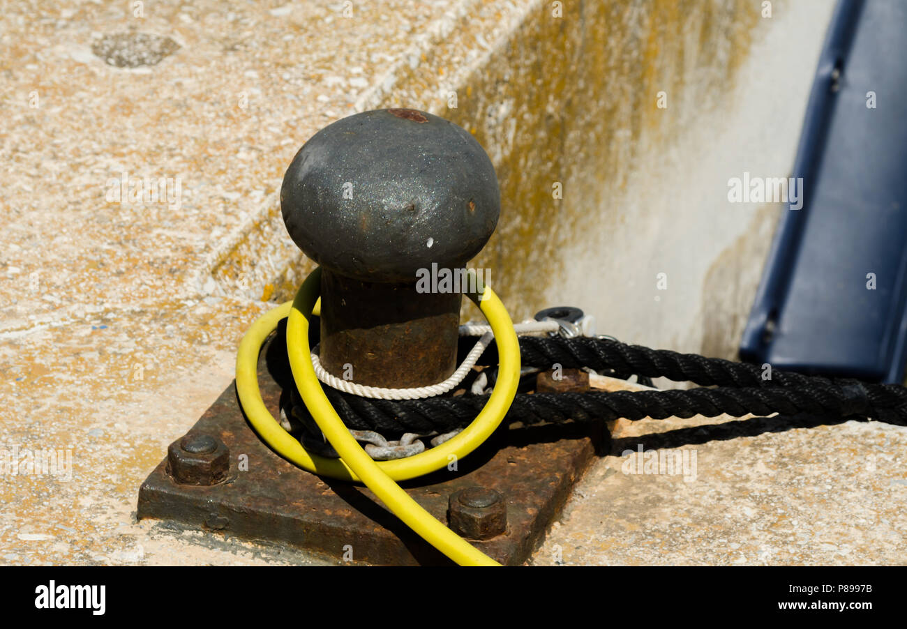 mooring post on the waterfront in a small marina, element for mooring ...