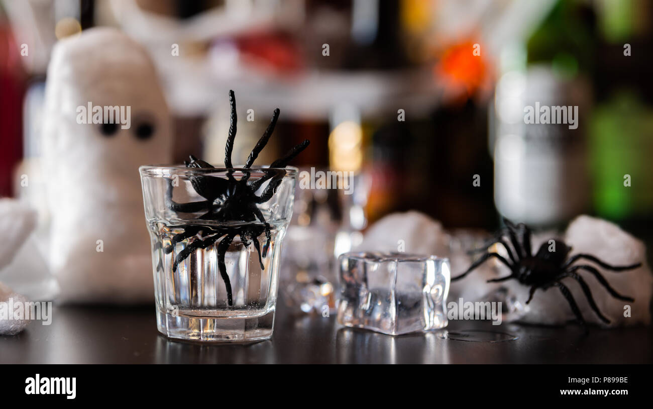 creepy halloween party cocktails with syringes of grenadine syrup as ...