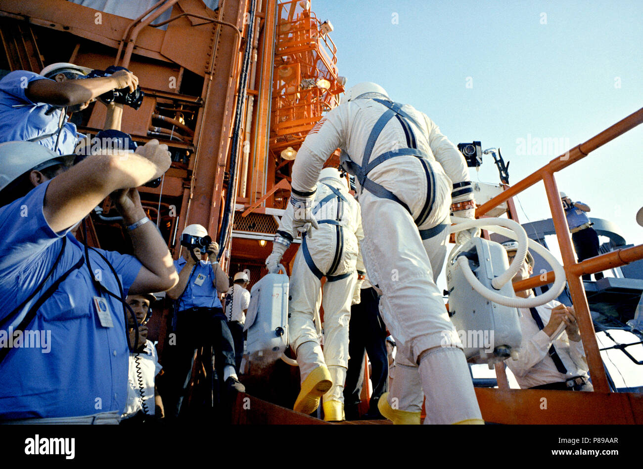 Back view of Astronauts L. Gordon Cooper Jr. (foreground) and Charles ...