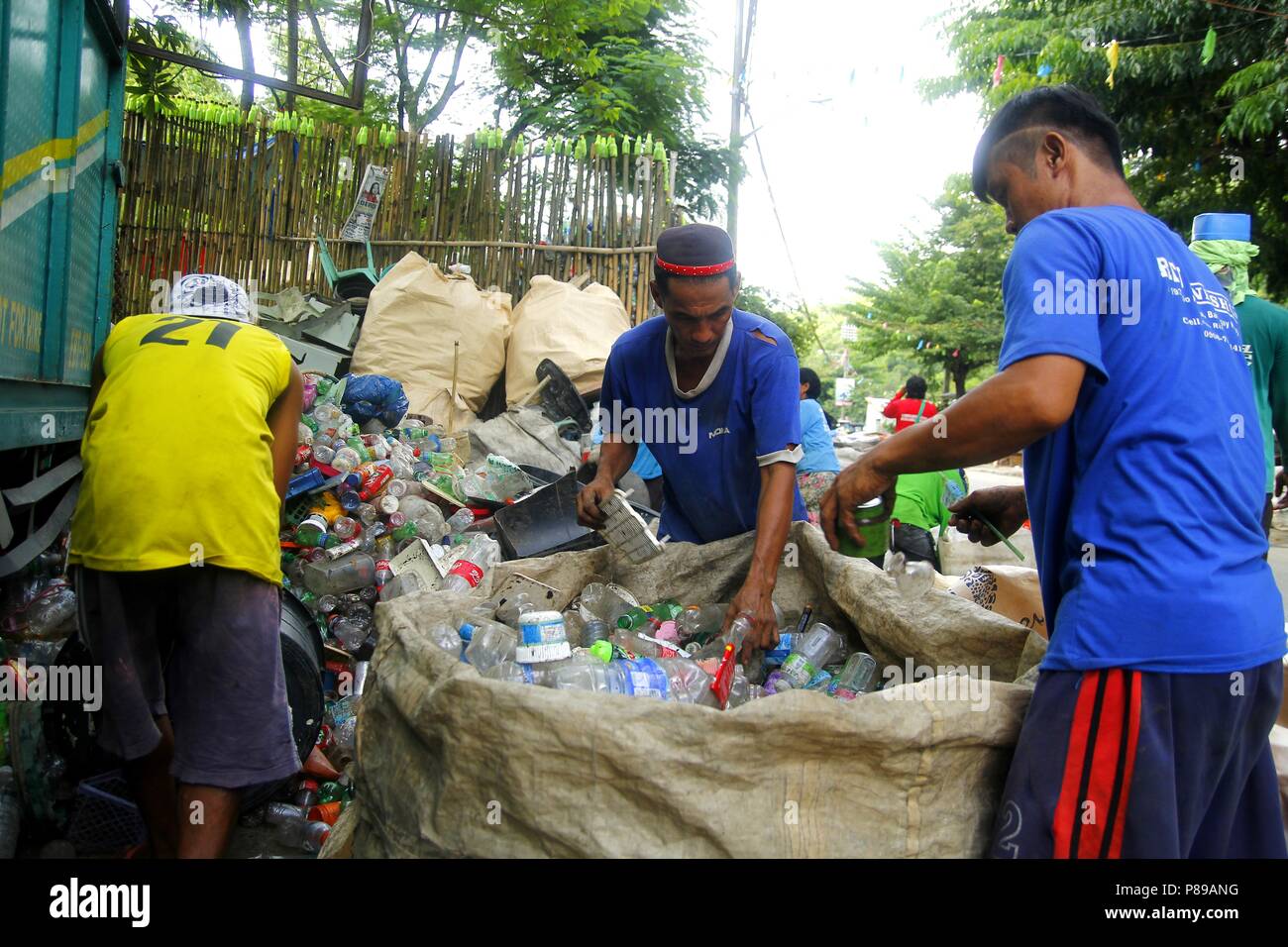 ANGONO, RIZAL, PHILIPPINES - JULY 4 2018: Workers of a materials ...