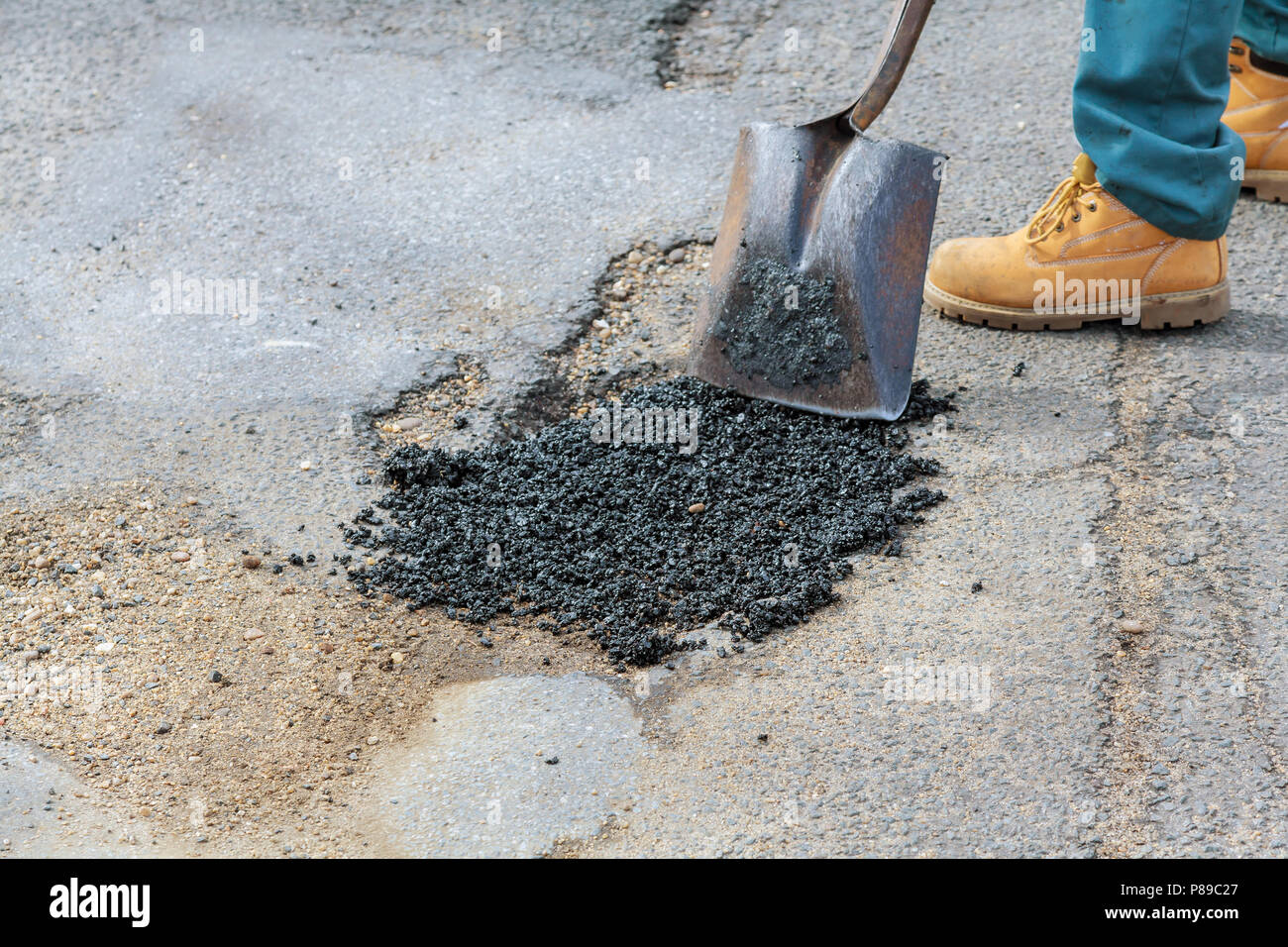 teamwork, new asphalt workers on a road construction, industry and Road ...