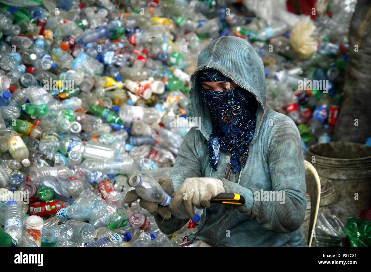 ANGONO, RIZAL, PHILIPPINES - JULY 4 2018: Workers of a materials ...