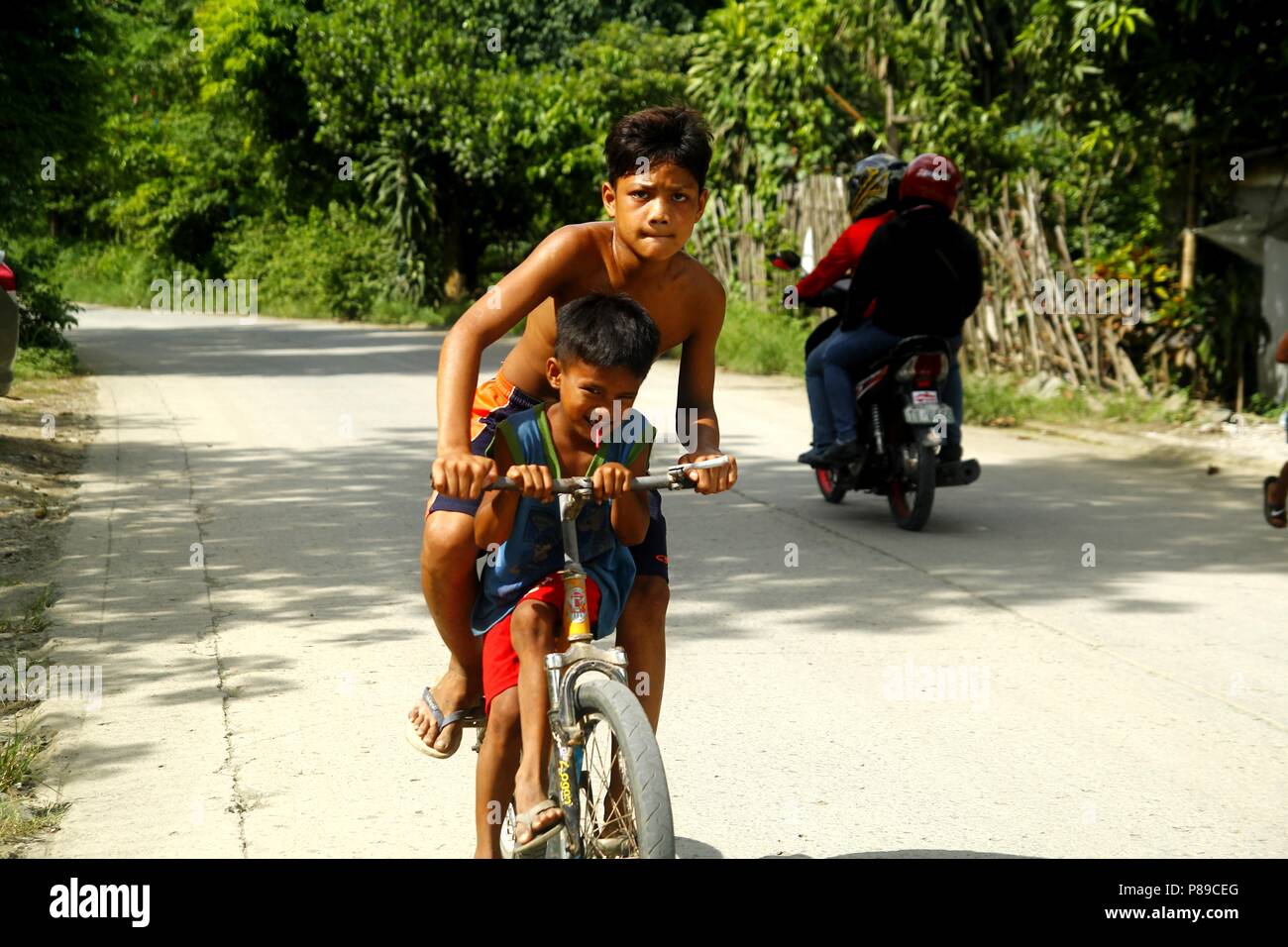 ANGONO, RIZAL, PHILIPPINES - JULY 4 2018: Young Filipino children play ...