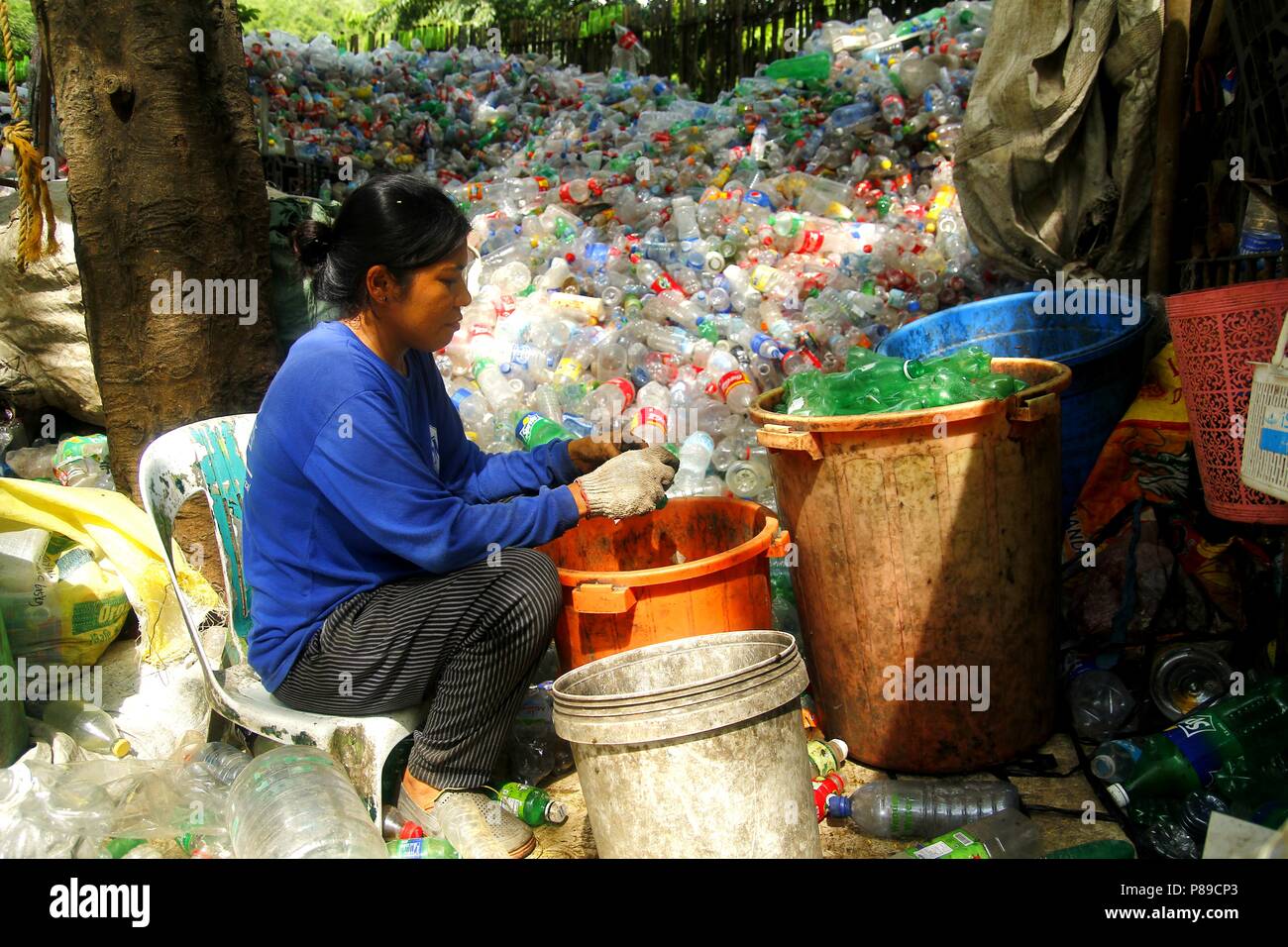 ANGONO, RIZAL, PHILIPPINES - JULY 4 2018: Workers of a materials ...