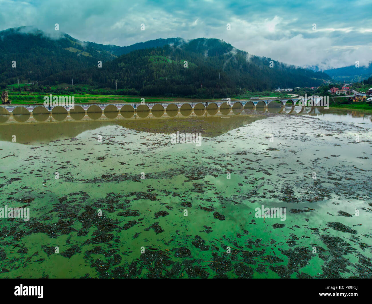 lake pollution in Romania, Carpathian mountain landscape Stock Photo ...