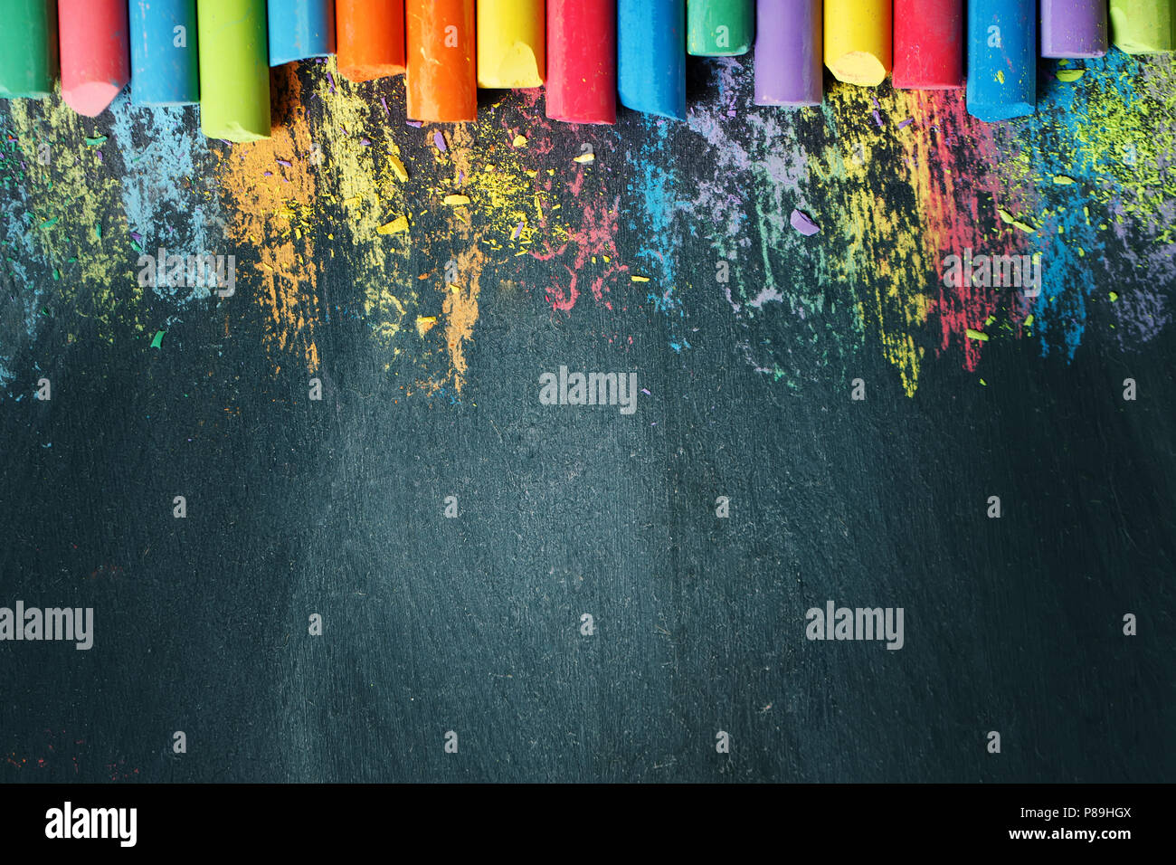 Colorful crayons on the blackboard, drawing. Back to school background ...