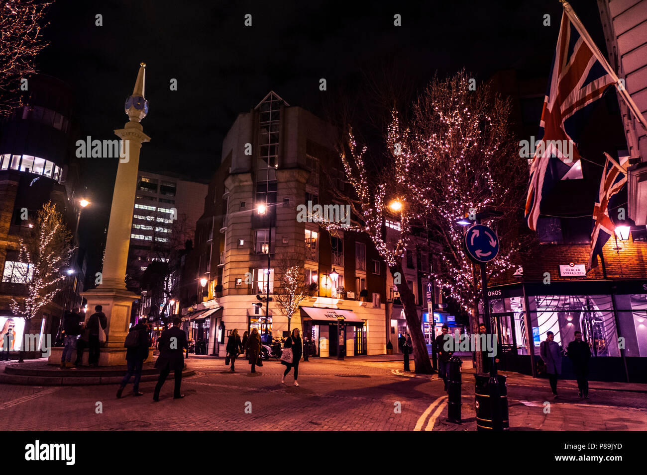 London, UK - March 15 2018: Night scene in the Seven Dials intersection ...