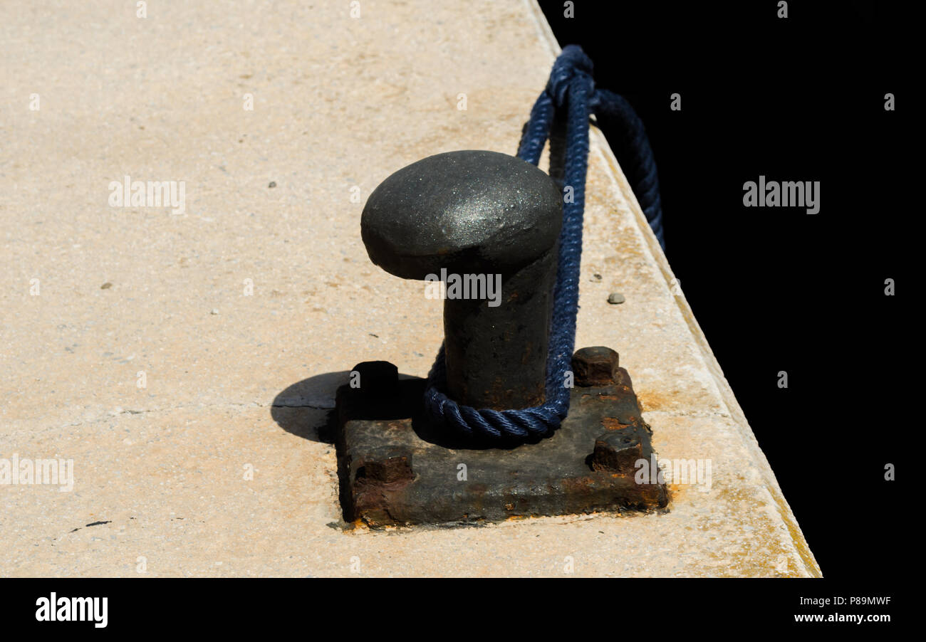 mooring post on the waterfront in a small marina, element for mooring ...