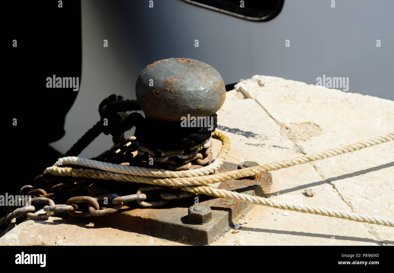 mooring post on the waterfront in a small marina, element for mooring ...