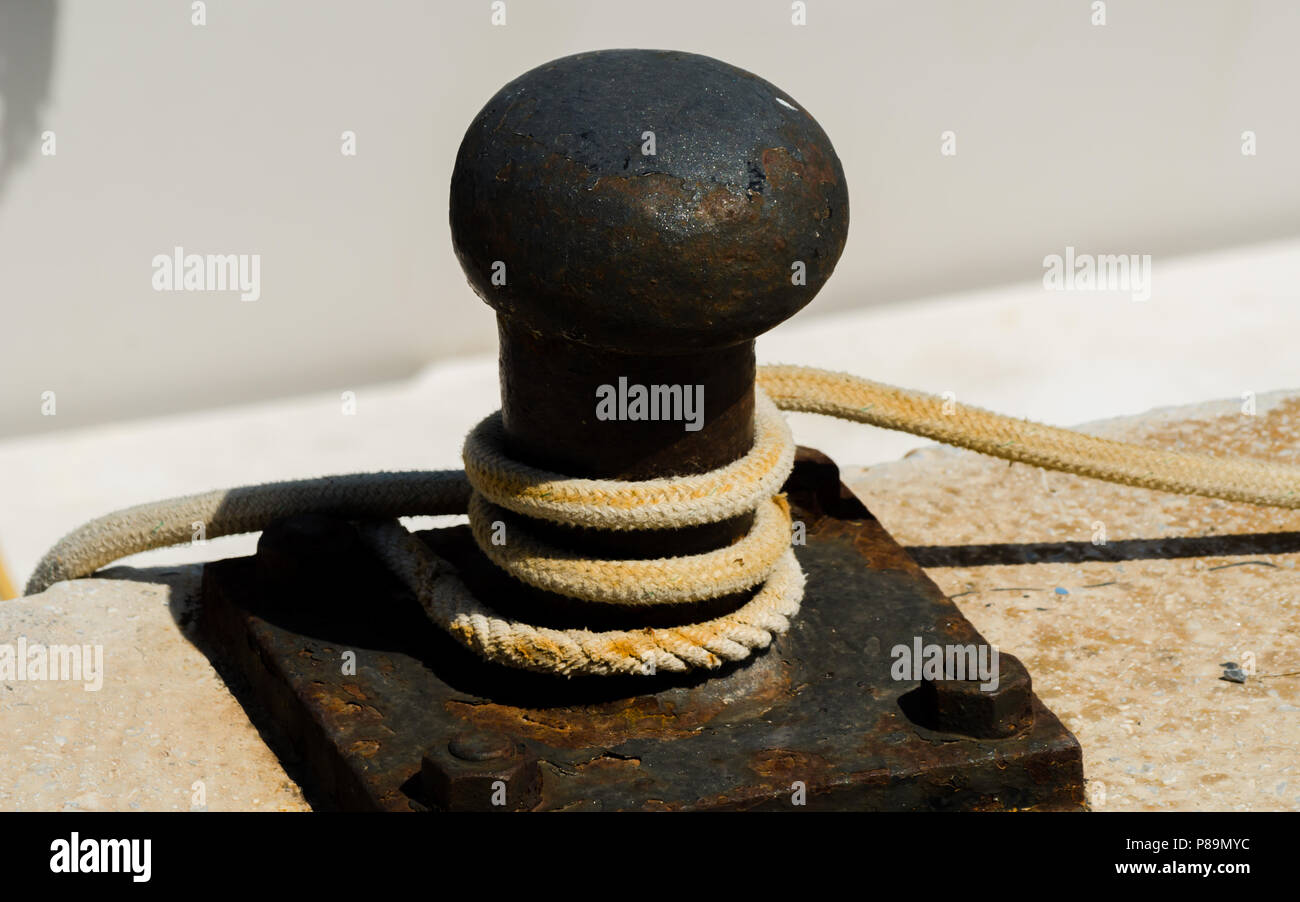 mooring post on the waterfront in a small marina, element for mooring ...